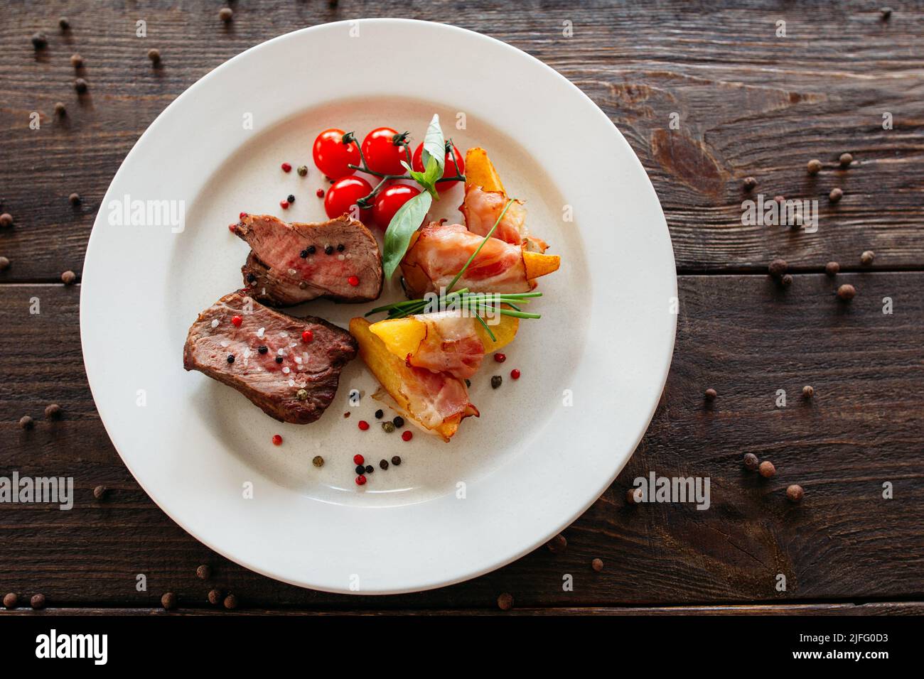 Medium rare pork steak with spices Stock Photo - Alamy