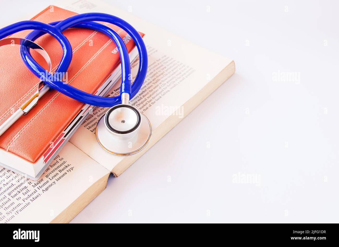 Stethoscope and books on a white background Stock Photo - Alamy