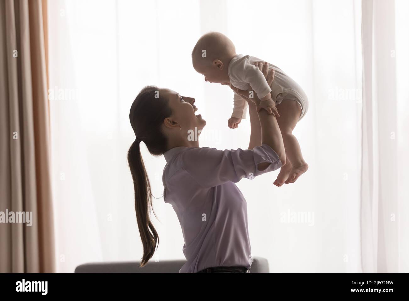 Mother play with baby air hi-res stock photography and images - Alamy