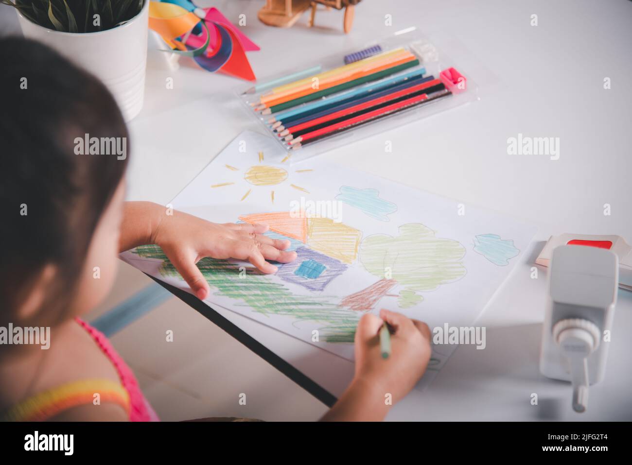 Happy child little girl colorful drawing landscape my home dream on ...