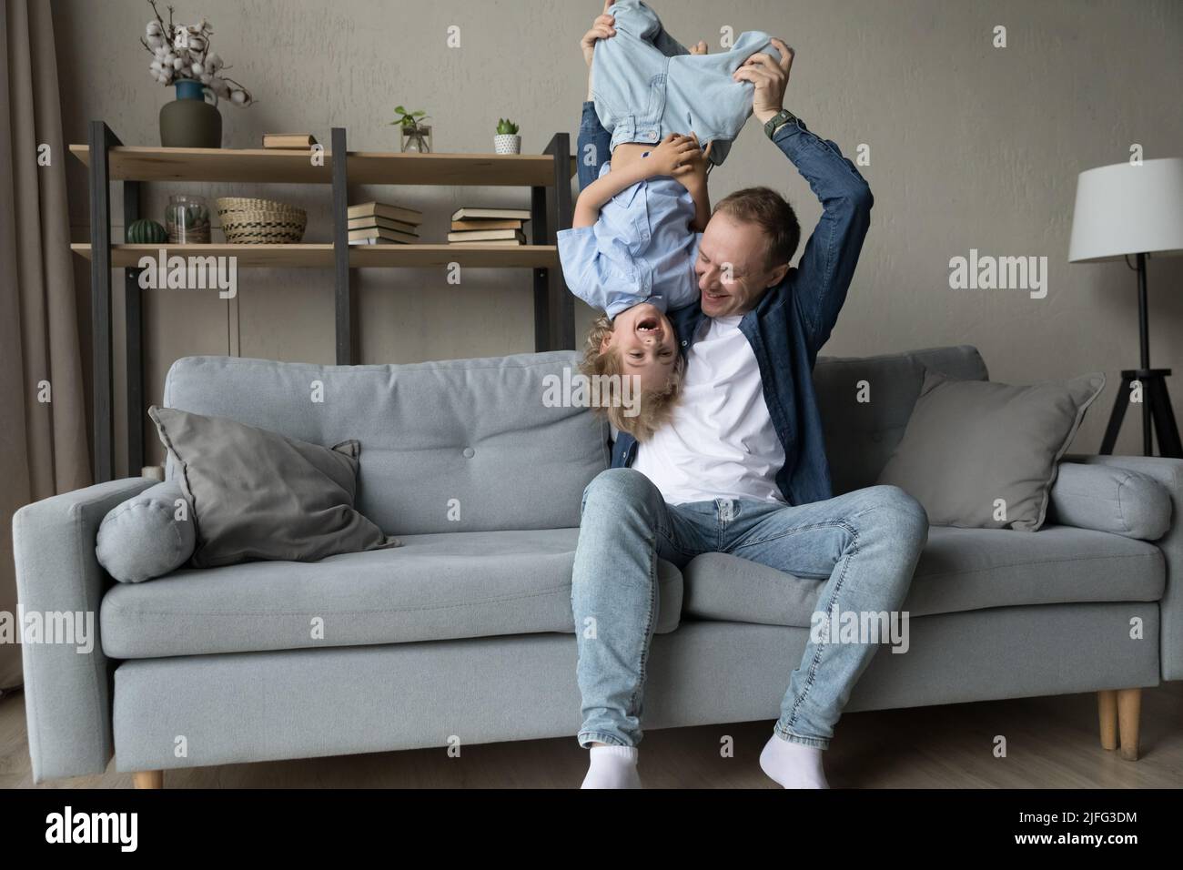 Cheerful father play with preschool 5s laughing son at home Stock Photo ...