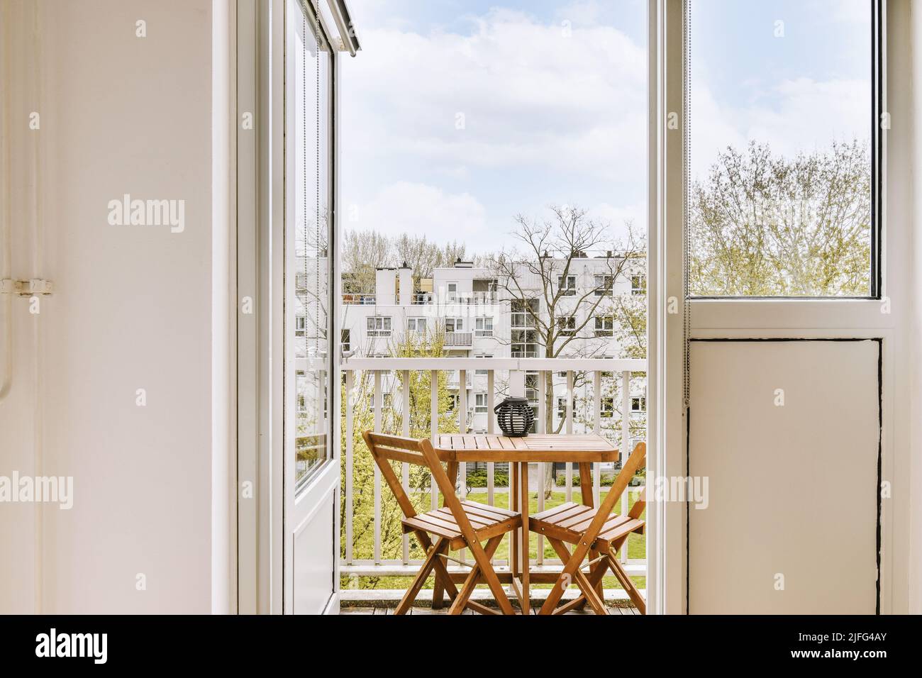 Front view of old brick buildings and cars with bicycles from small ...