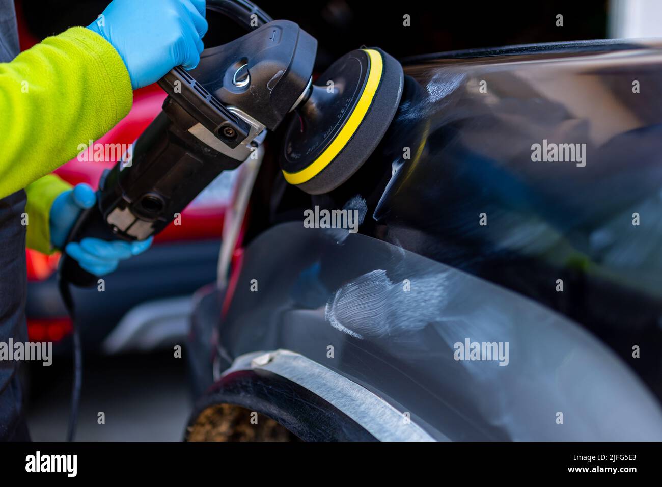 car polishing with polishing machine, badly scratched black car Stock ...