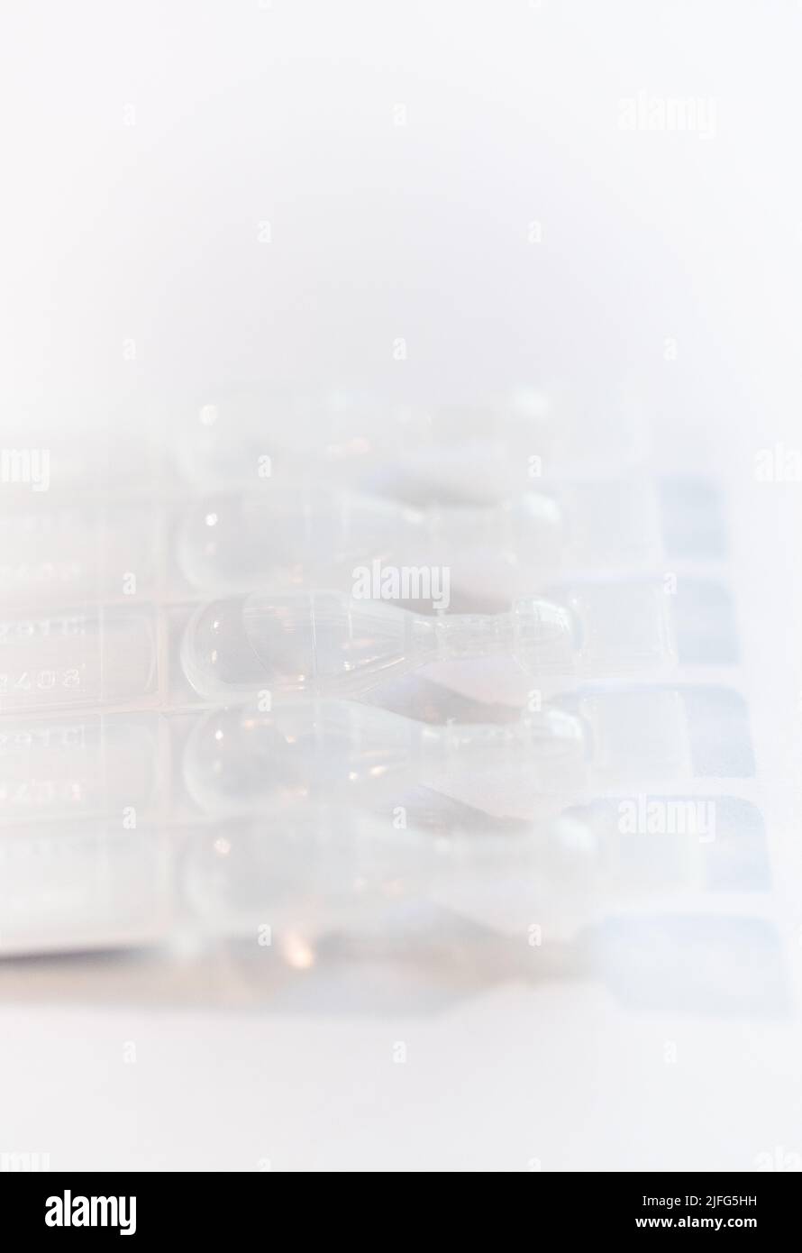 Photo of containers for eye drops on white background Stock Photo - Alamy