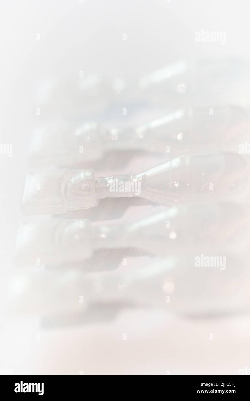 Photo of containers for eye drops on white background Stock Photo - Alamy