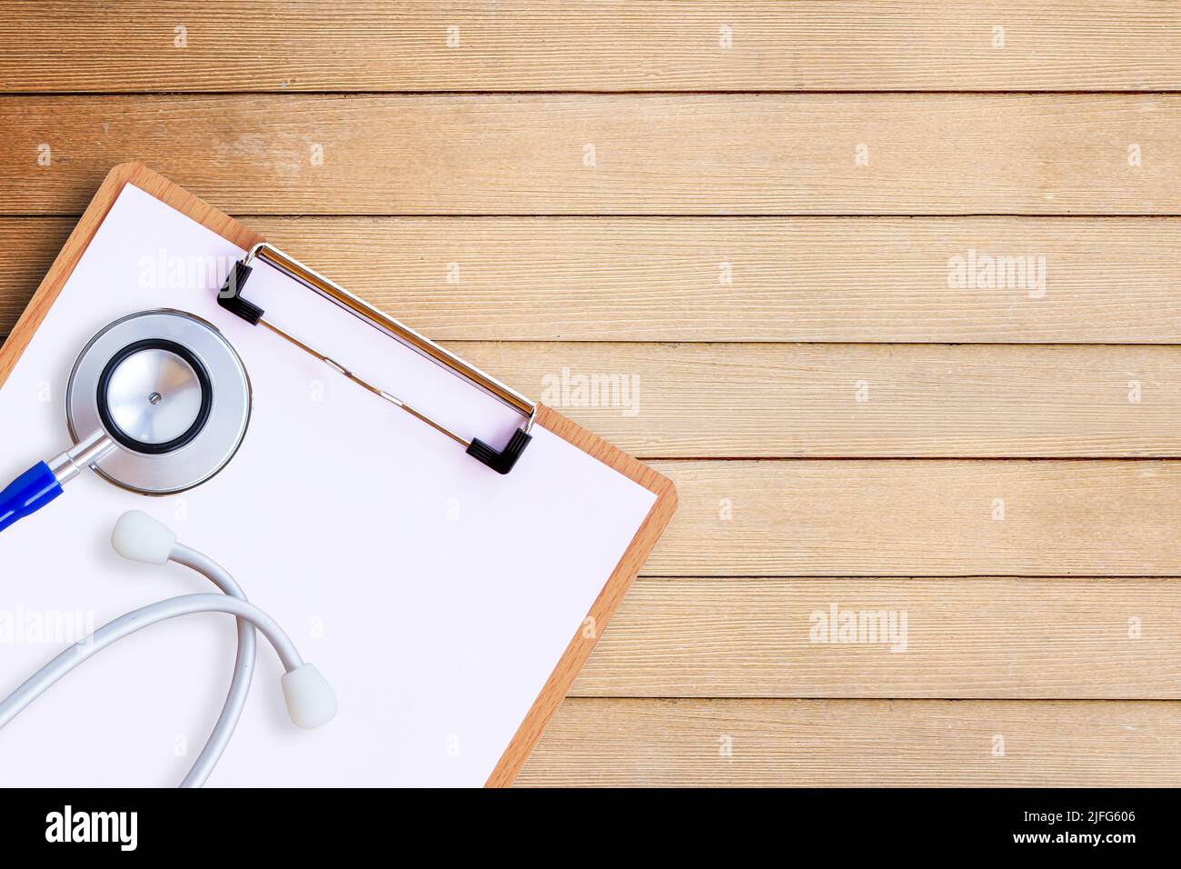 Medical equipment with medical form on wooden doctor desk background ...