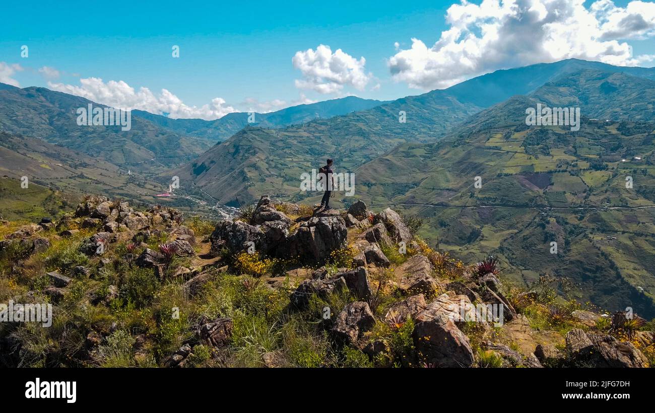 A young male hiking in the mountains Stock Photo - Alamy