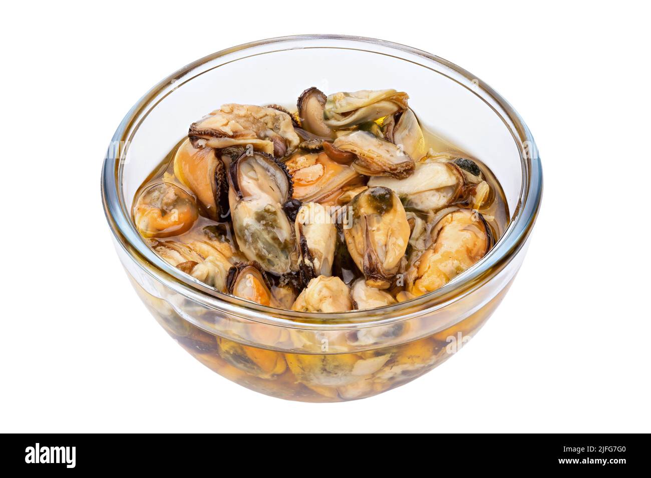 Marinated mussels isolated in в стекляной прозрачной чаше on a white ...