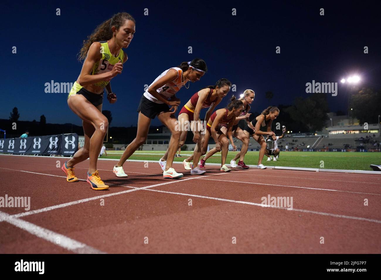 runners at the start of the women's 3,000m (from left) Fiona O'Keefe ...