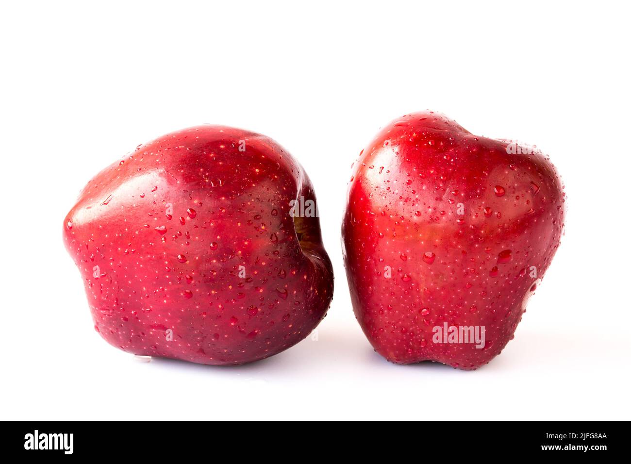 Two red apple with water drops on a white background Stock Photo - Alamy