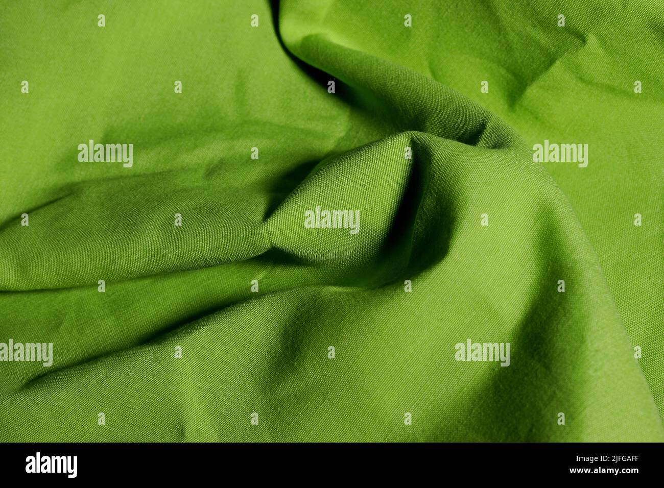 Close-up green fabric texture background Stock Photo - Alamy