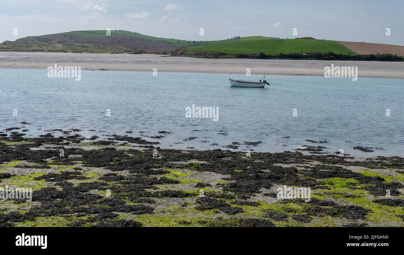 A boat near the shore at low tide. Seaside landscape. Sea mud Stock ...