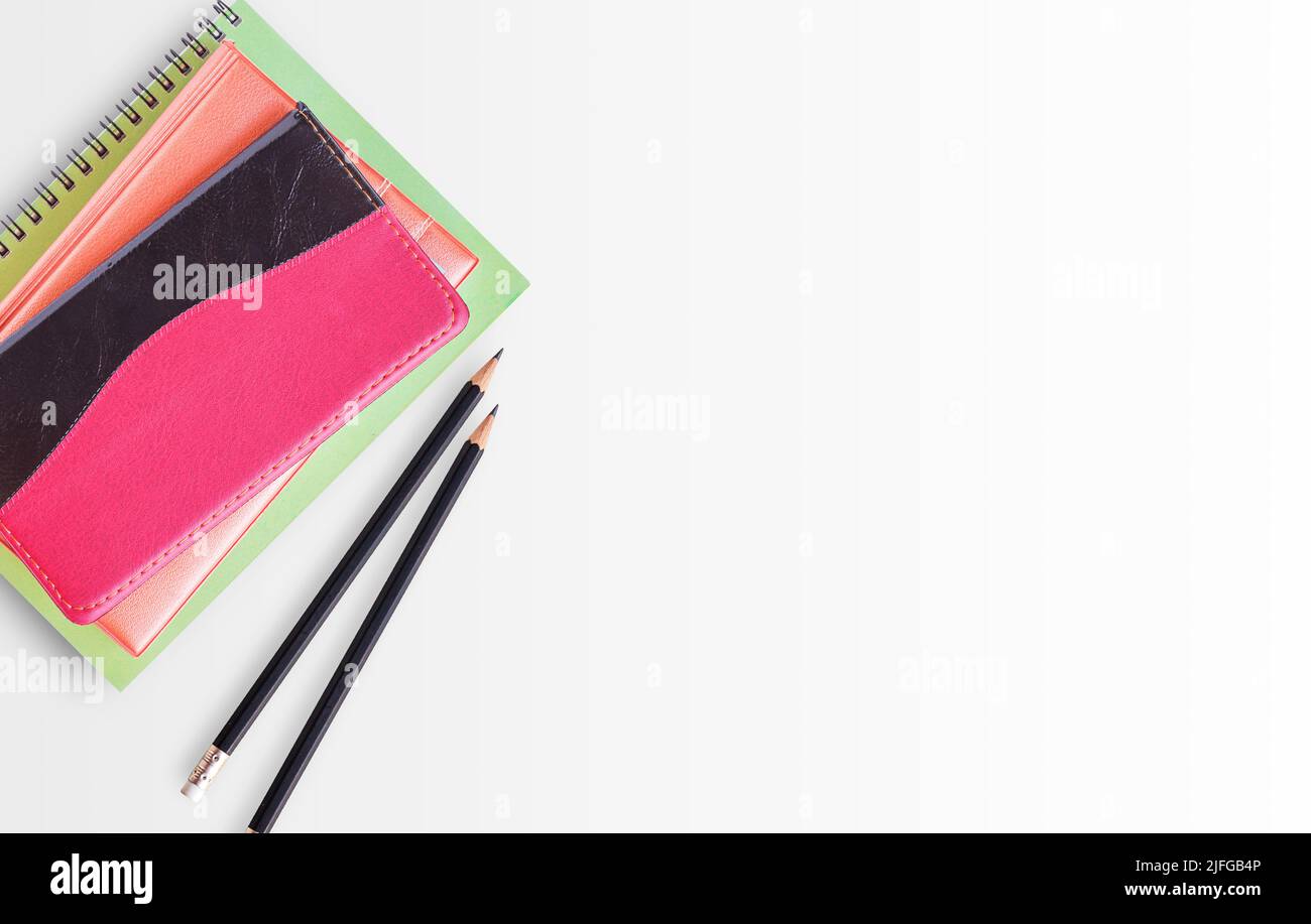 Notebook and pencil on office desk or white talbe background. top view ...