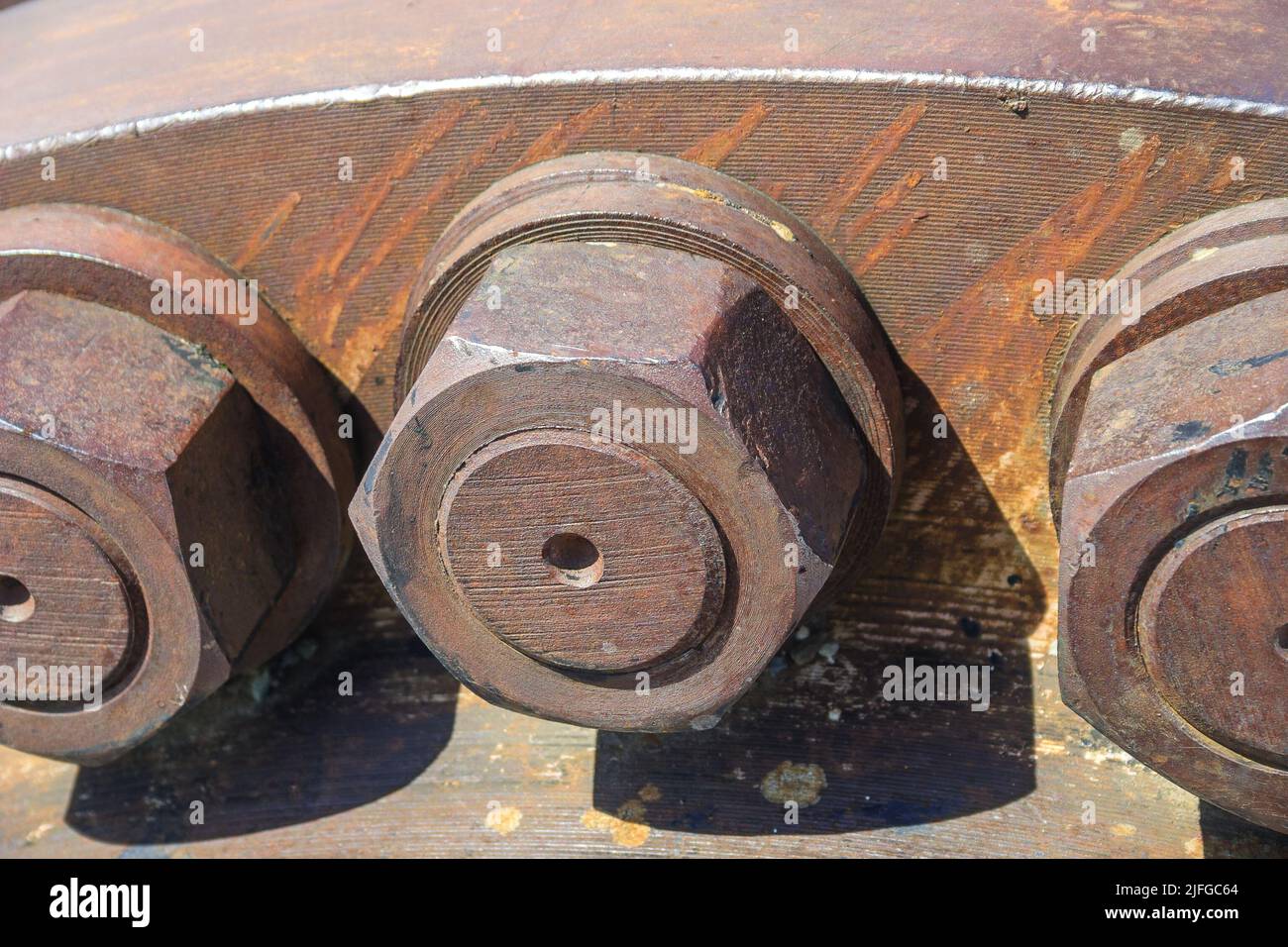 Big rust nuts in a circular row (shallow focus Stock Photo - Alamy