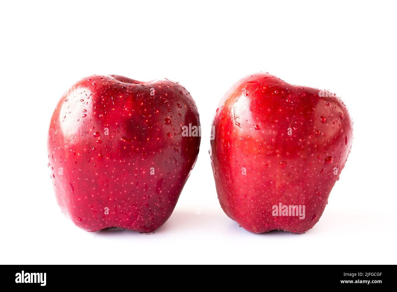 Two red apple with water drops on a white background Stock Photo - Alamy