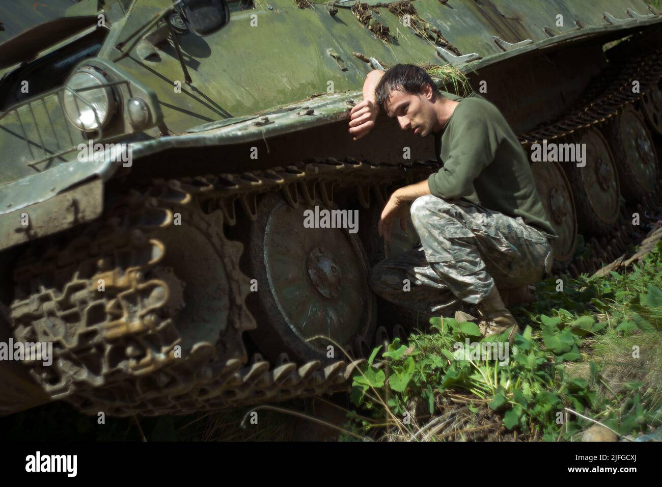 Soldier near the damaged armored personnel carrier Stock Photo - Alamy