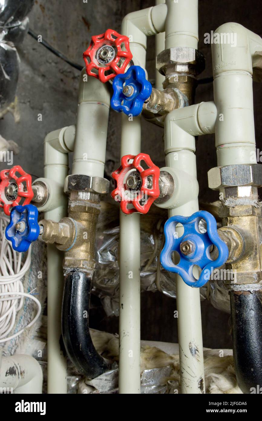 Water pipes with a valves of red and blue Stock Photo - Alamy