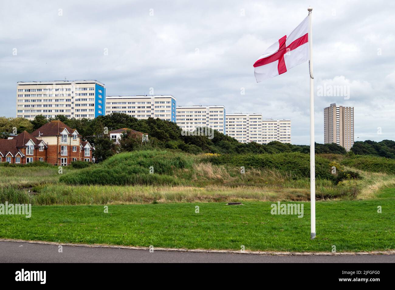 English Flag in Weston Shore, with tower blocks in the background ...
