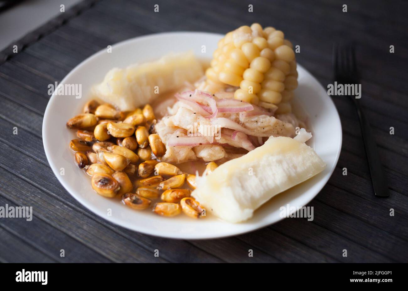 Peruvian traditional dish.fish ceviche with yuka and corn Stock Photo ...