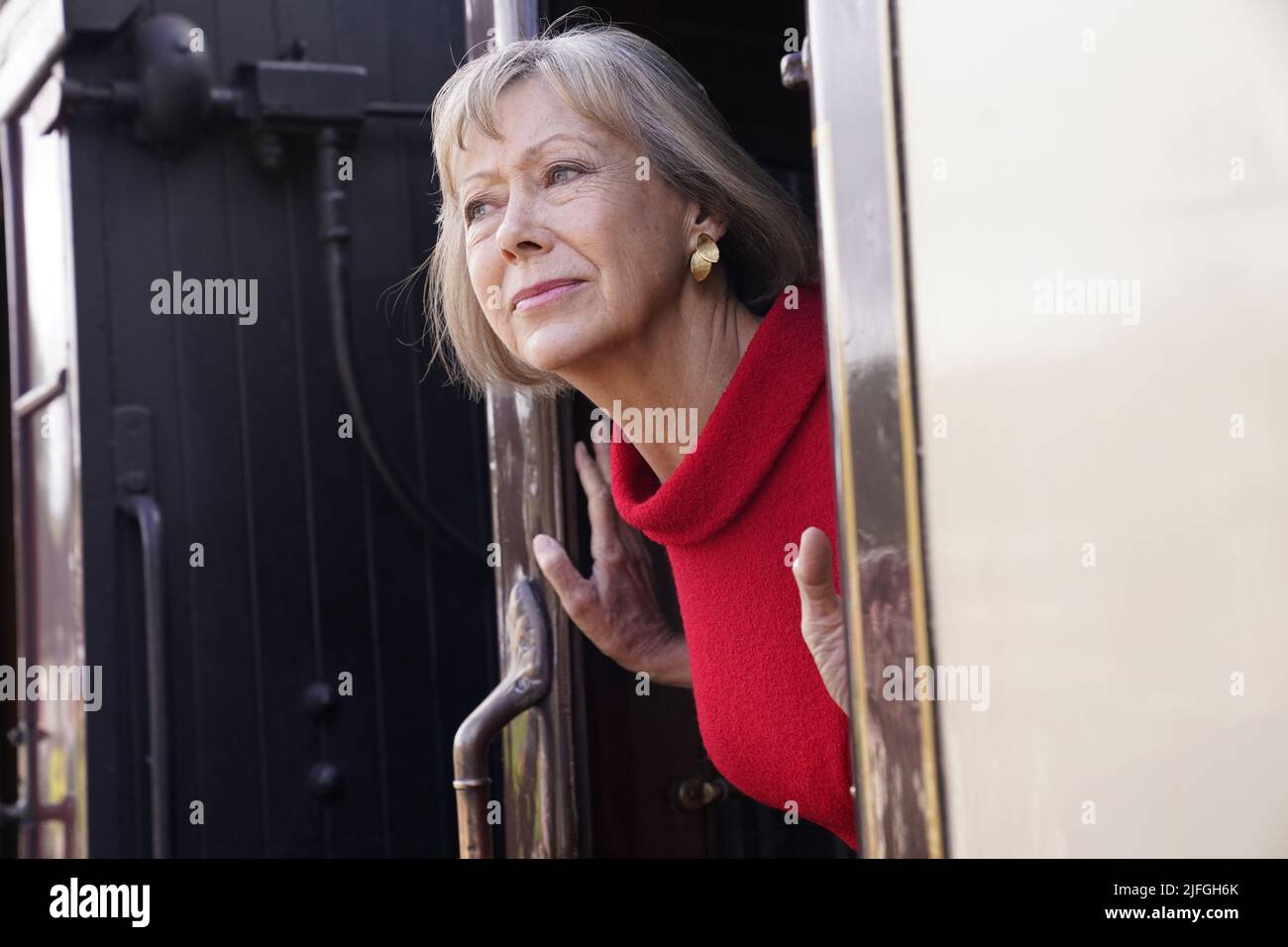 Jenny Agutter on a train at Oakworth Station, West Yorkshire to attend ...