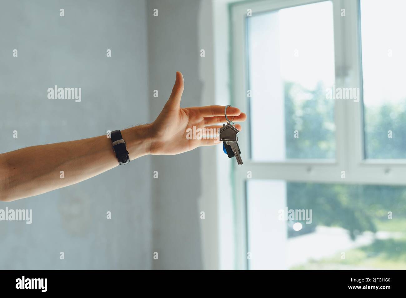 Crop close up of hand show praise house keys moving to first own new ...