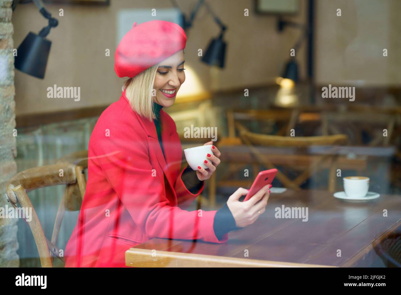 Positive woman coffee surfing hi-res stock photography and images - Alamy