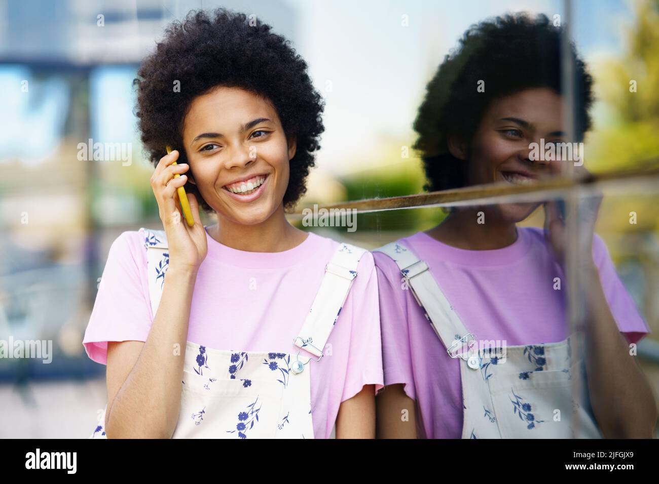 Cheerful black woman talking hi-res stock photography and images - Alamy