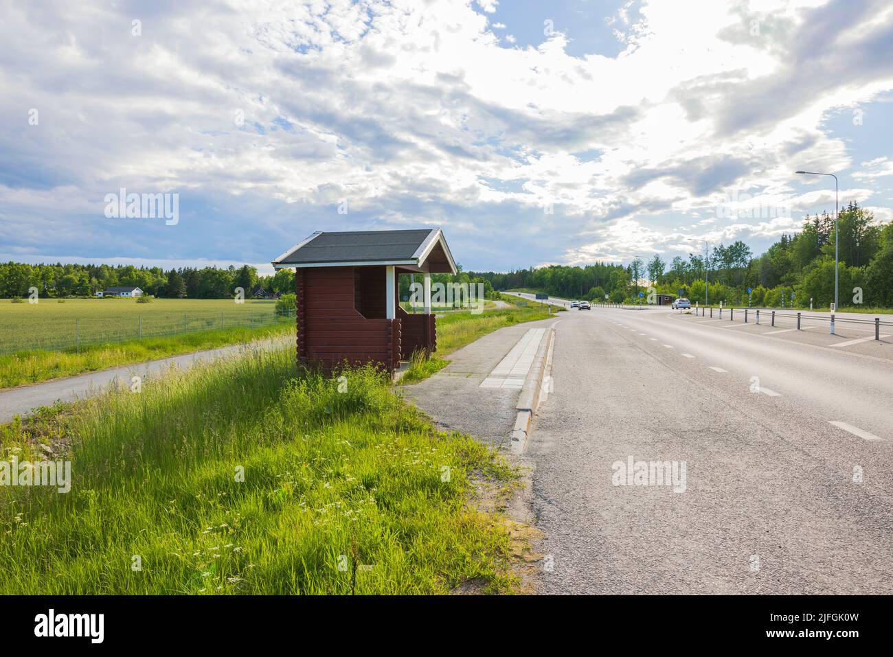 Red wooden bus stop hi-res stock photography and images - Alamy
