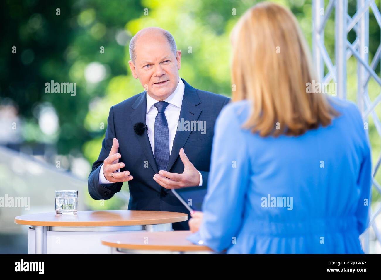 Berlin, Germany. 03rd July, 2022. Chancellor Olaf Scholz (SPD) talks to ...