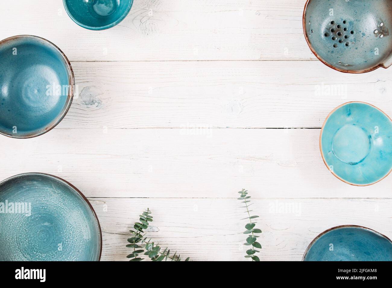 Many turquoise empty ceramic plates. Flat lay Stock Photo - Alamy