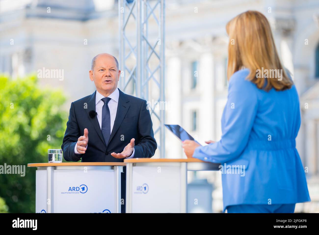 Berlin, Germany. 03rd July, 2022. Chancellor Olaf Scholz (SPD) talks to ...