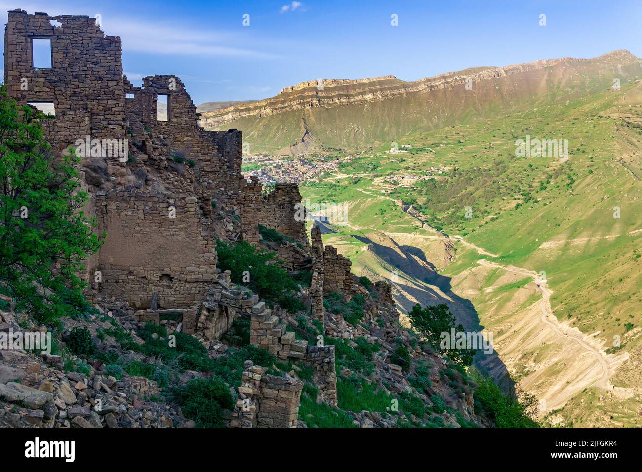 walls of abandoned houses on a mountain cliff in the ghost village of ...