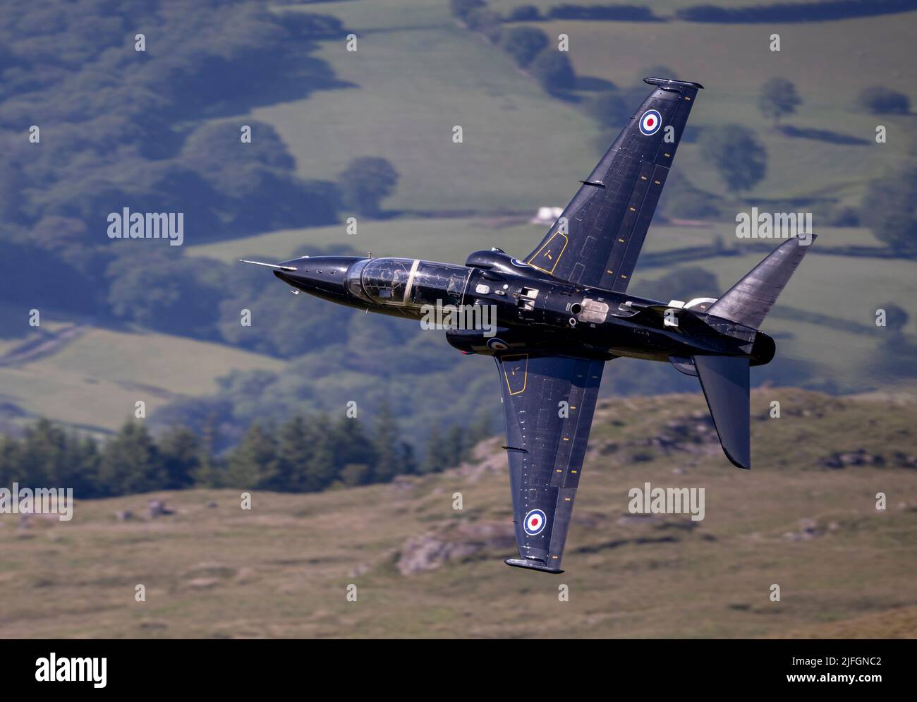 RAF Hawk T2 jet trainer, on a low level flying mission through the ...