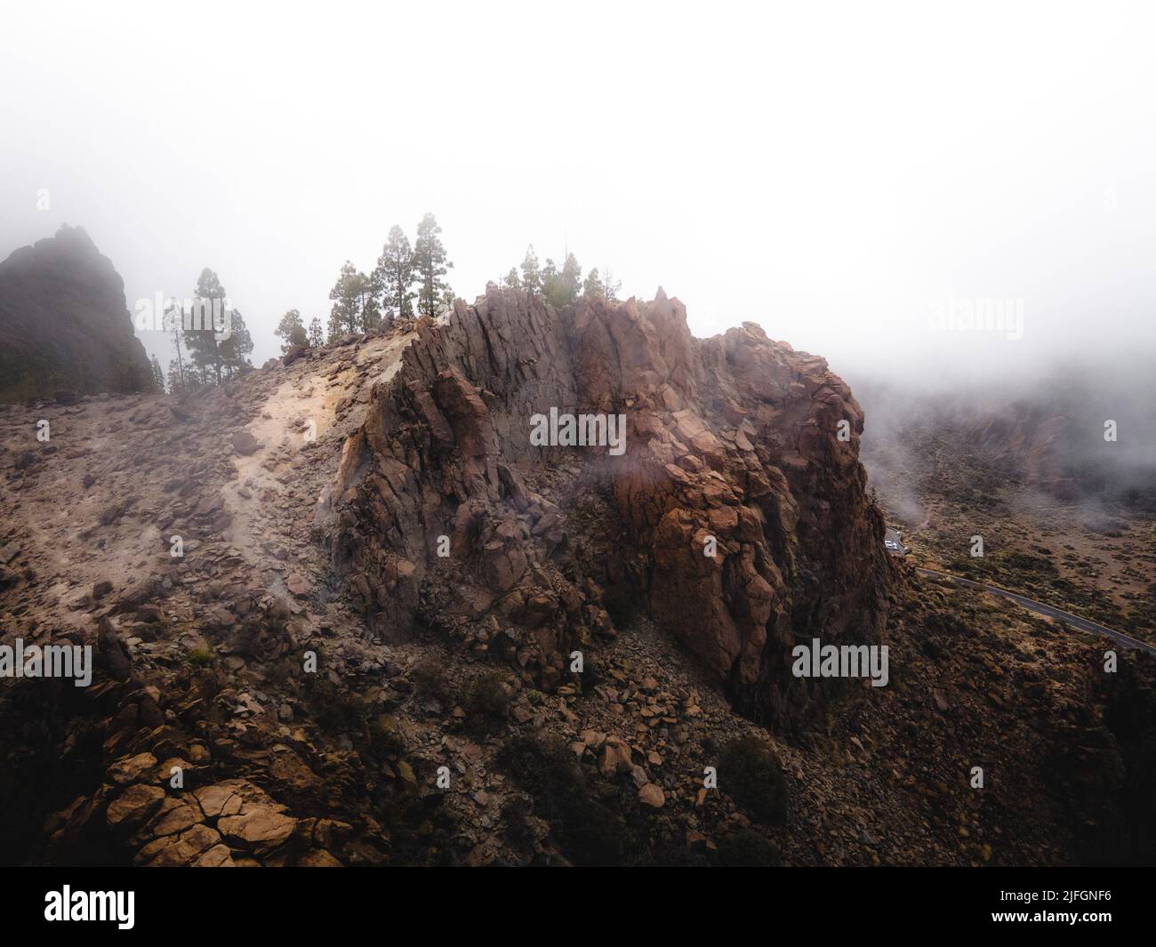 An Aerial shot of Desert landscape of rocky hills covered by fog Stock ...