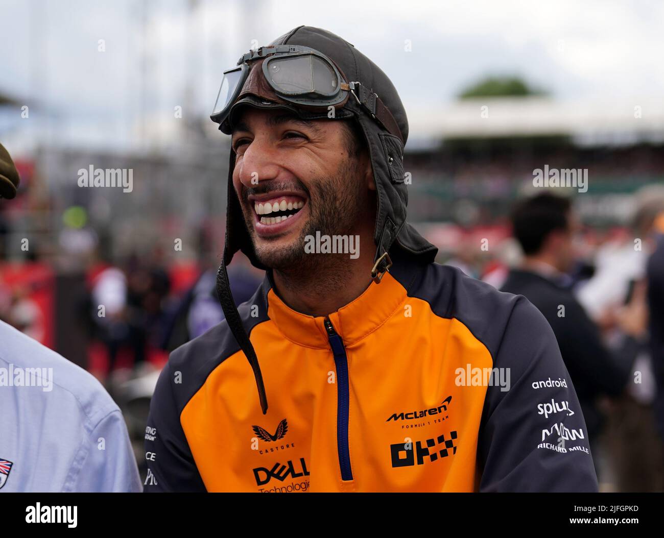 McLaren's Daniel Ricciardo arrives at the starting grid ahead of the ...
