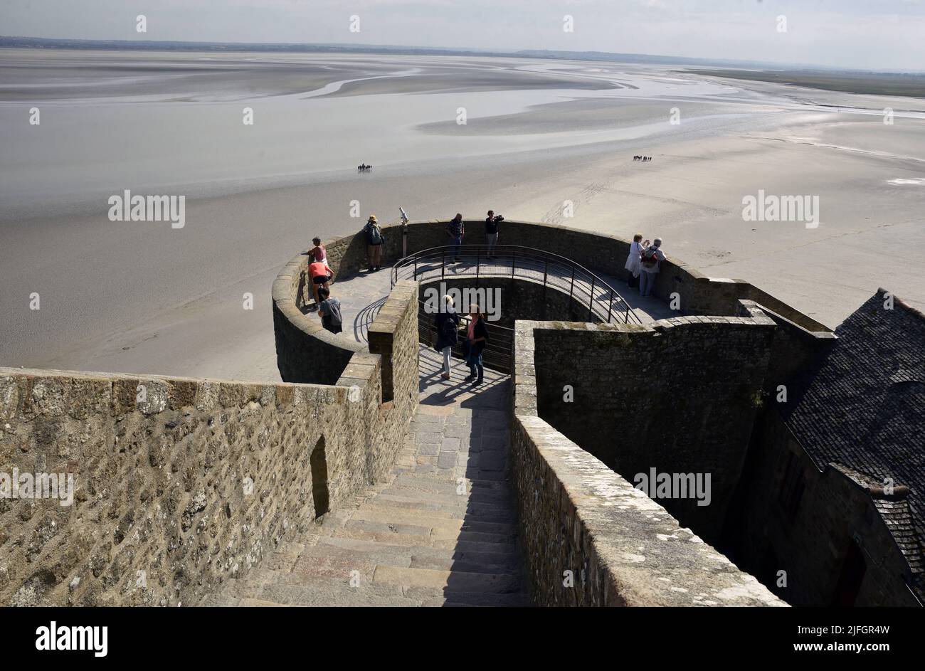 French town Mont Saint Michel and its Abbey and ramparts, located in ...