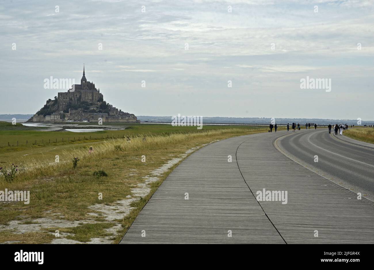 French town Mont Saint Michel and its Abbey and ramparts, located in ...