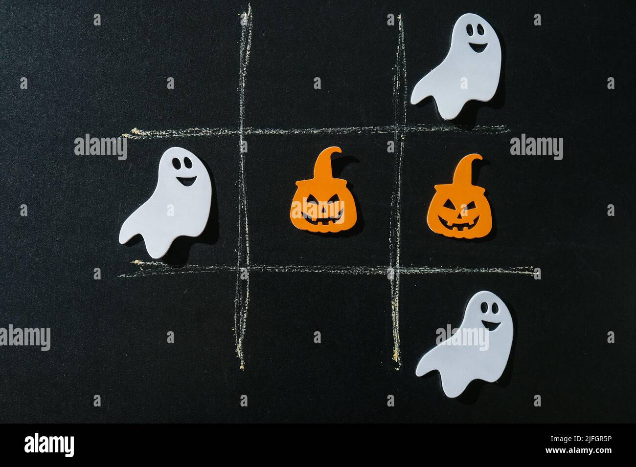 Creative tic tac toe game made of halloween decorations. Ghost bat ...