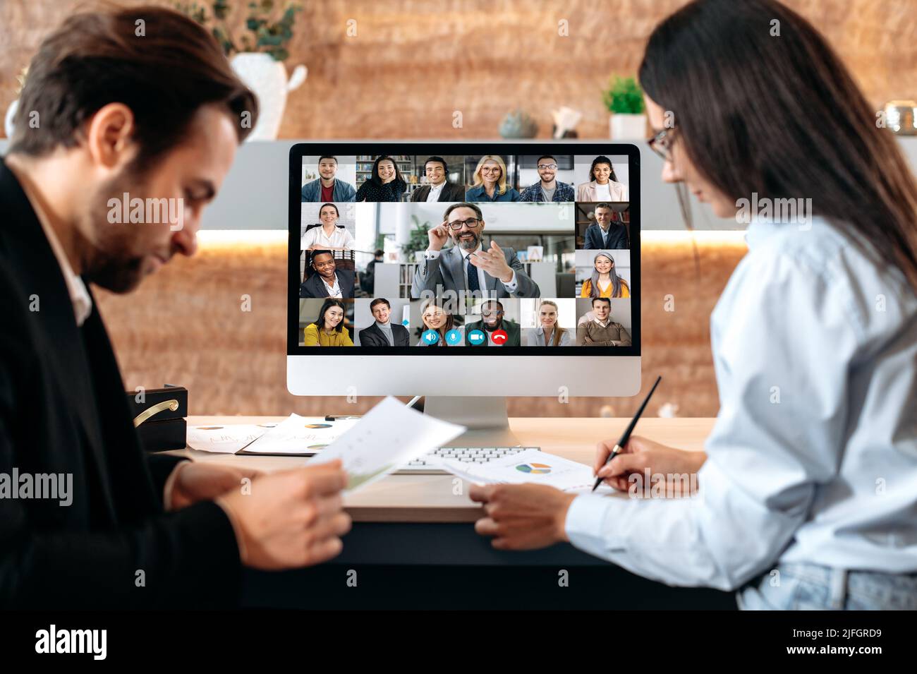 Teamwork, cooperation concept. Caucasian colleagues, a man and a woman ...