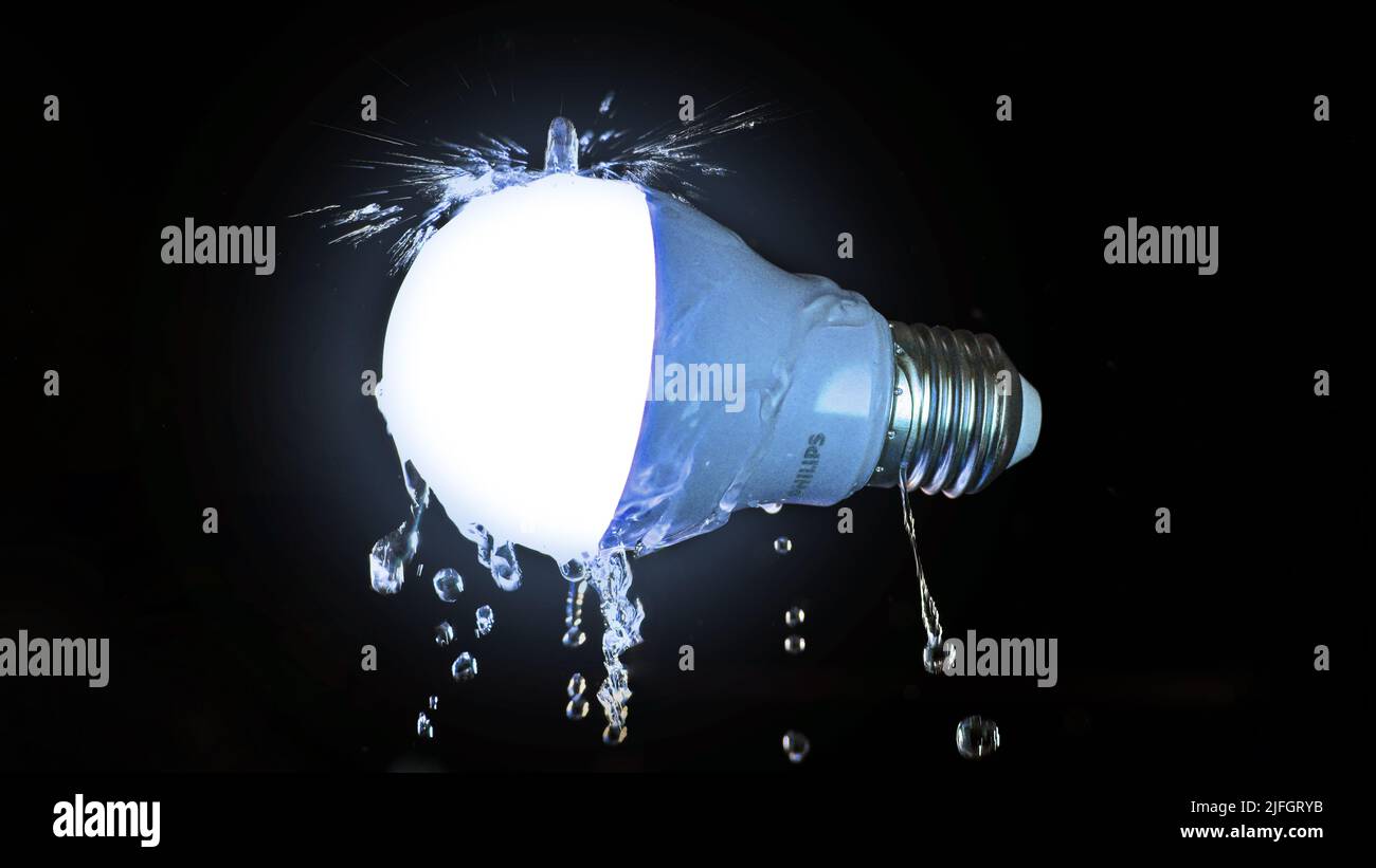 Bulb with water splash Stock Photo - Alamy