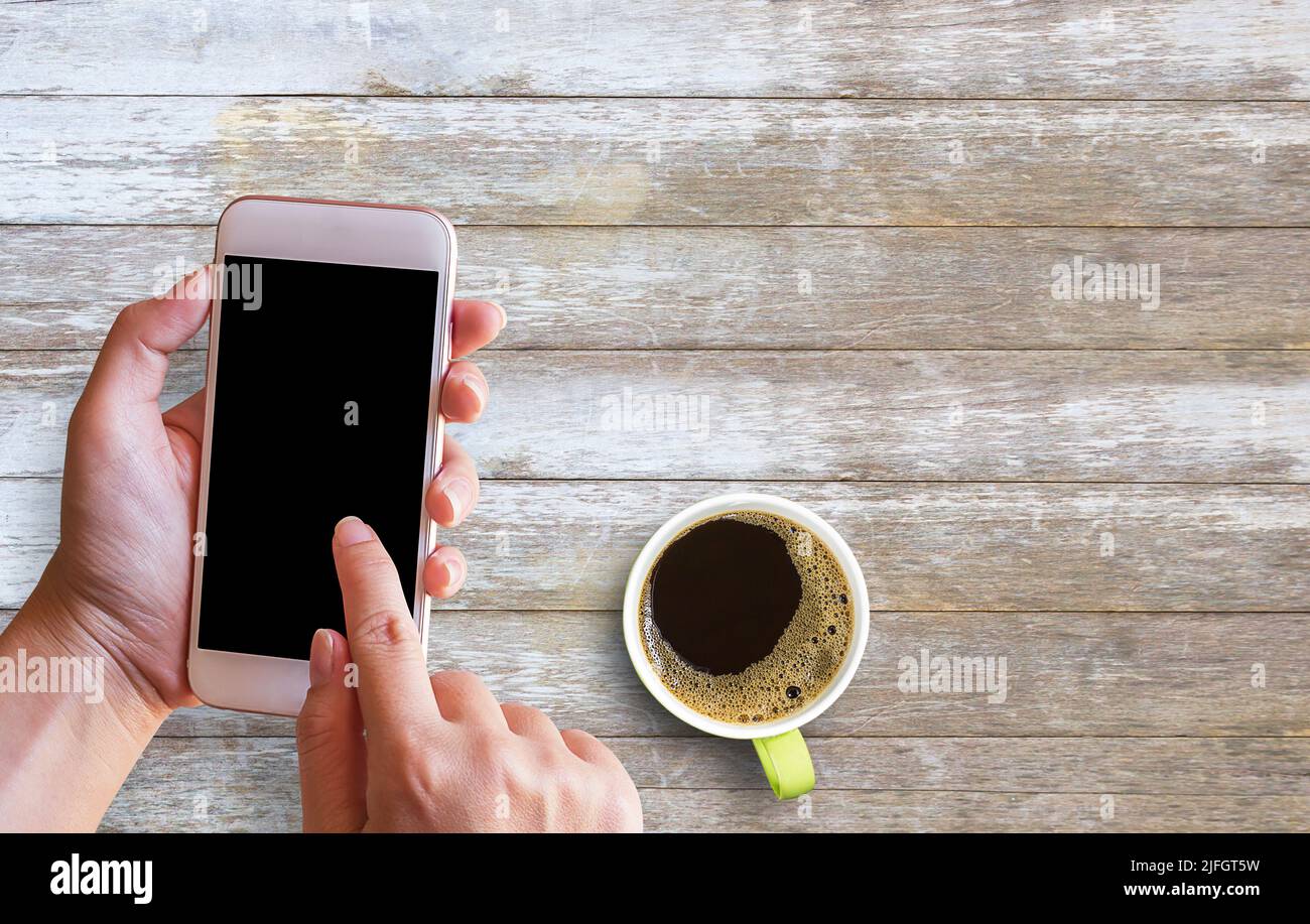 Female hand holding smart phone with blank copy space for your ...