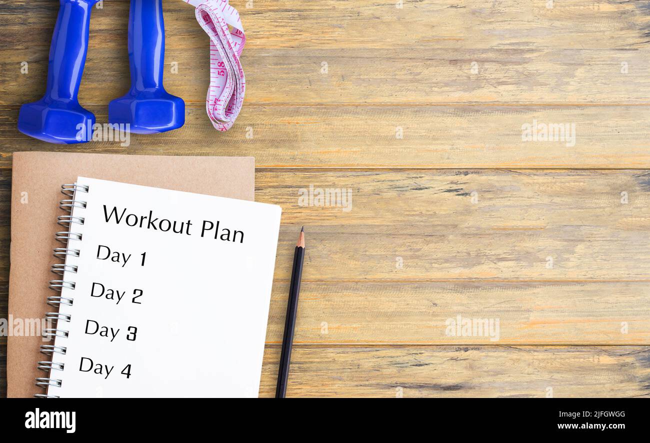 Flat lay – Blue dumbbell, Measuring Tape, Pencil and health clipboard ...