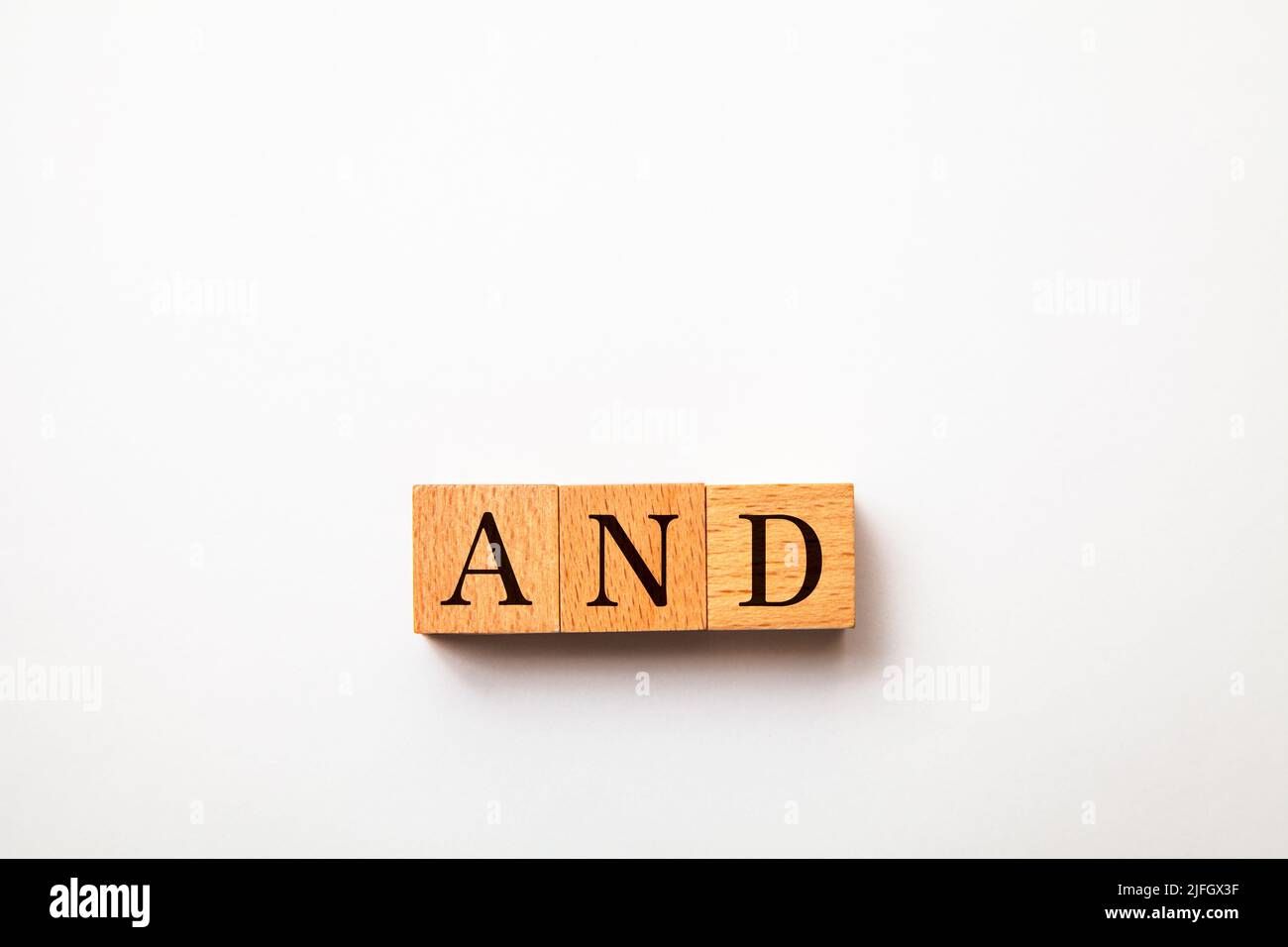 The character of AND. and. Written on three wooden blocks. Black ...