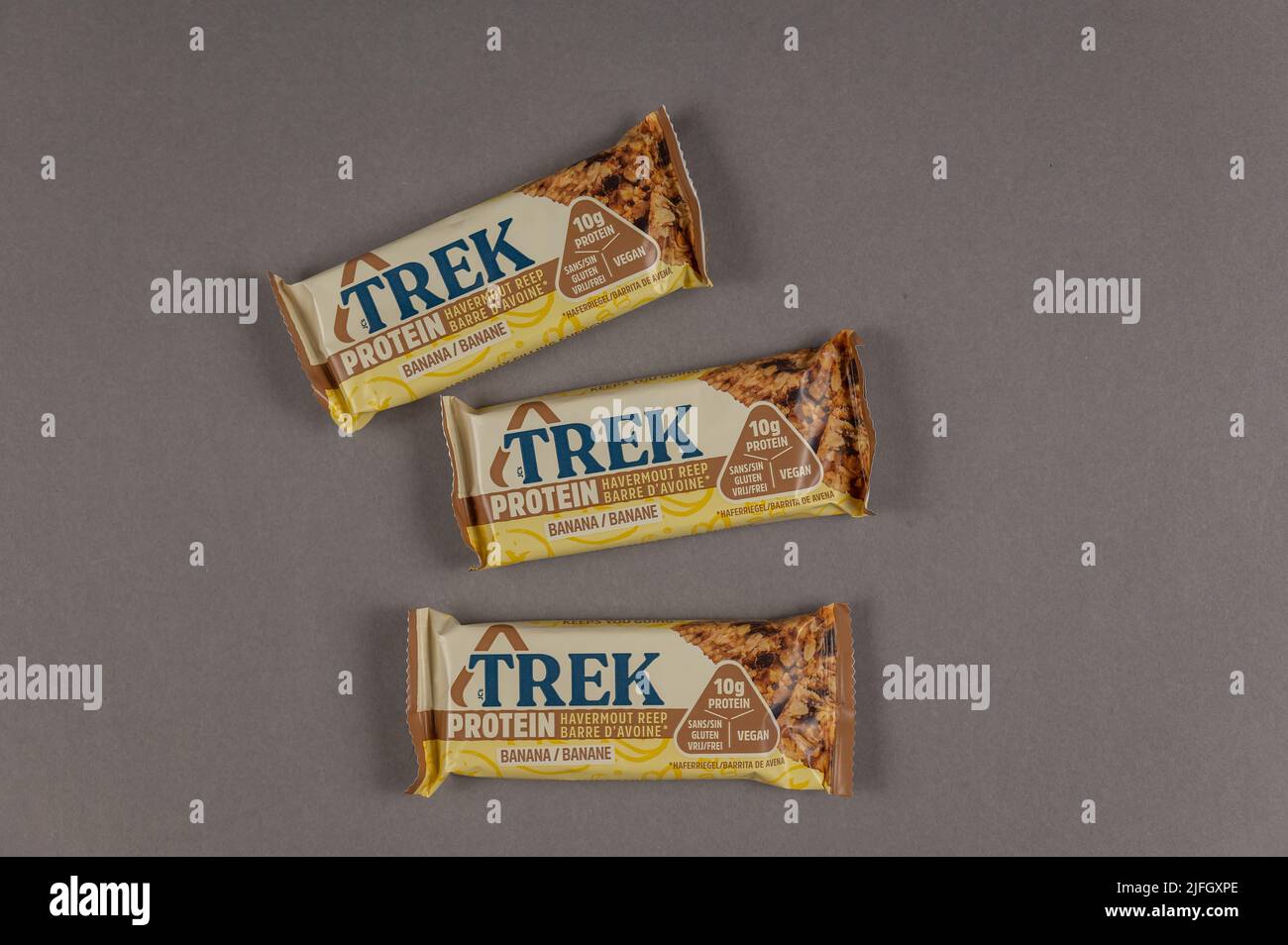 Three TREK Protein Energy Bars on Gray. A gluten-free, sugar-free snack ...