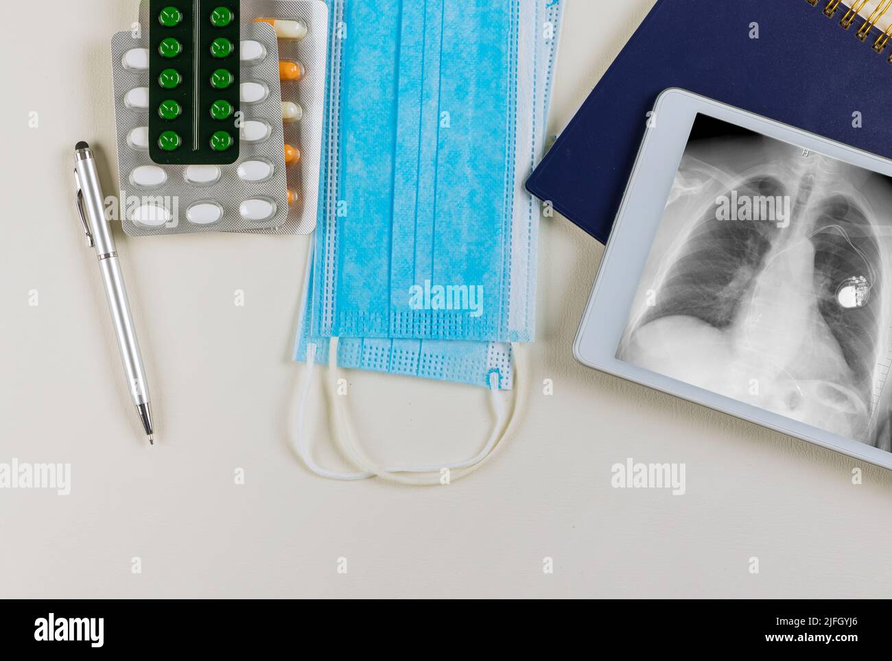 With an x-ray and a monitor, the doctor checks the correct placement of ...