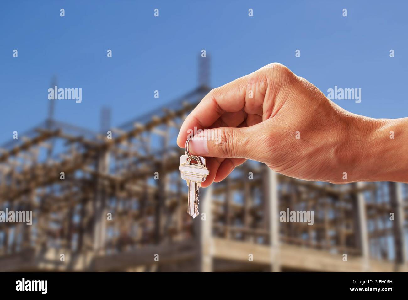 Human hand holding house key with blurred background Stock Photo - Alamy