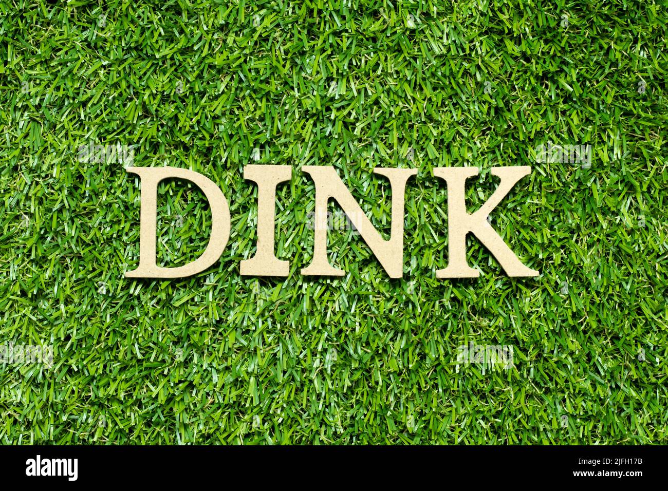 Wood alphabet letter in word DINK (Abbreviation of Double income, no ...