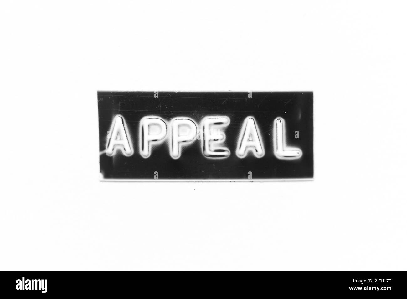 Black color banner that have embossed letter with word appeal on white ...