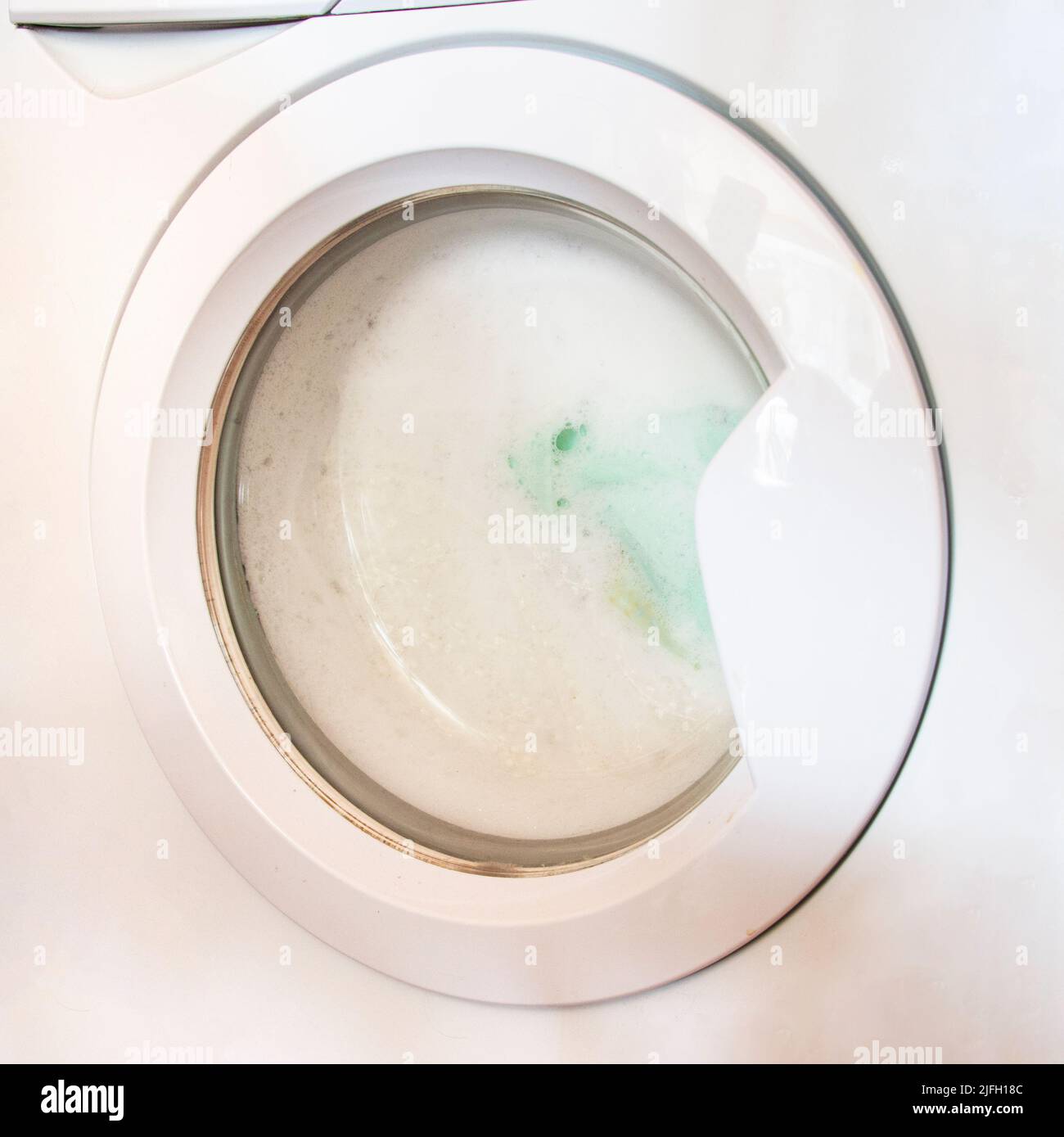 Window part of washing machine home object Stock Photo - Alamy
