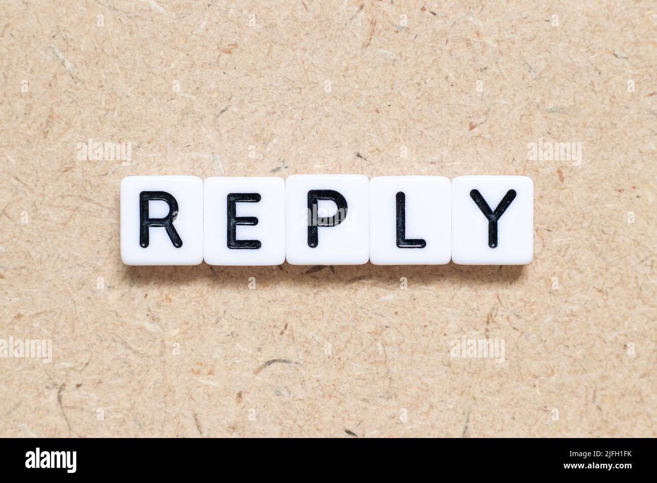 White tile alphabet letter with word reply on wood background Stock ...